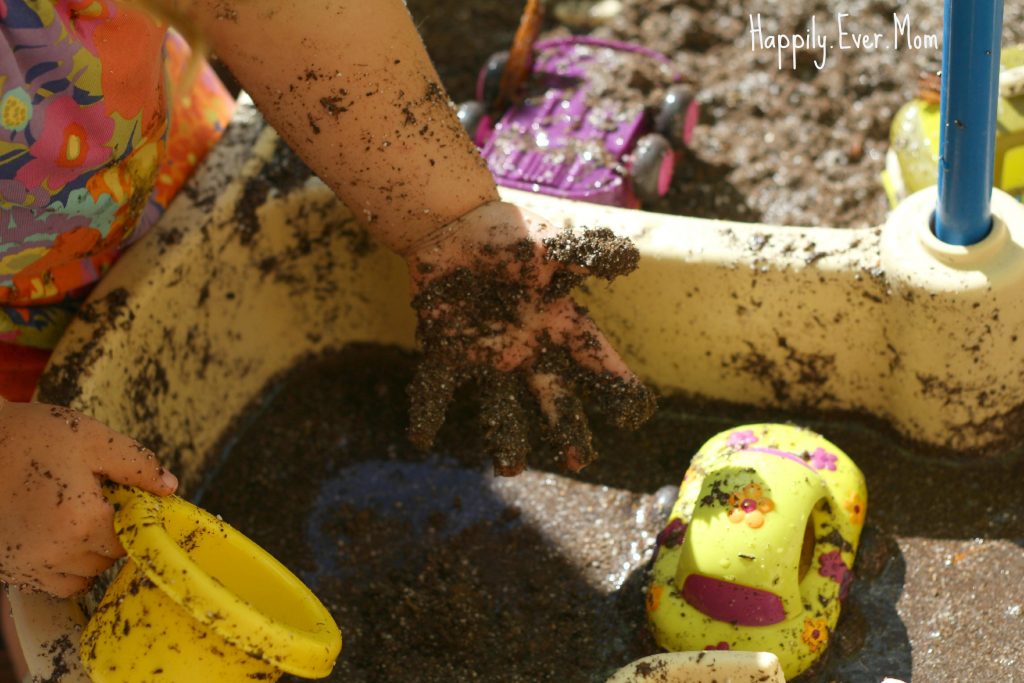 Lil's muddy hand watermark - Happily Ever Mom